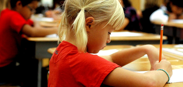 Girls make higher grades than boys in all school subjects, analysis finds